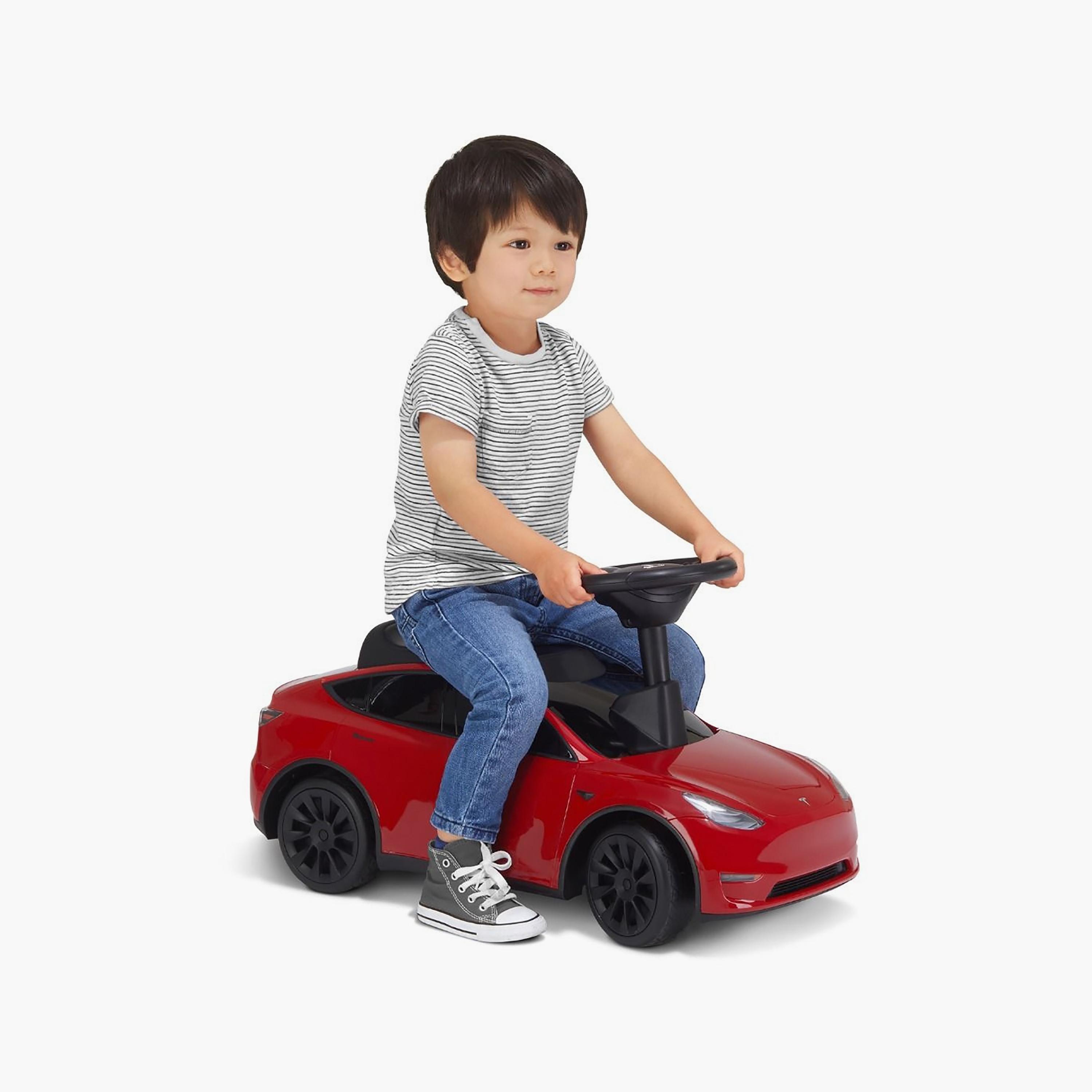 Tesla toy car ride on store