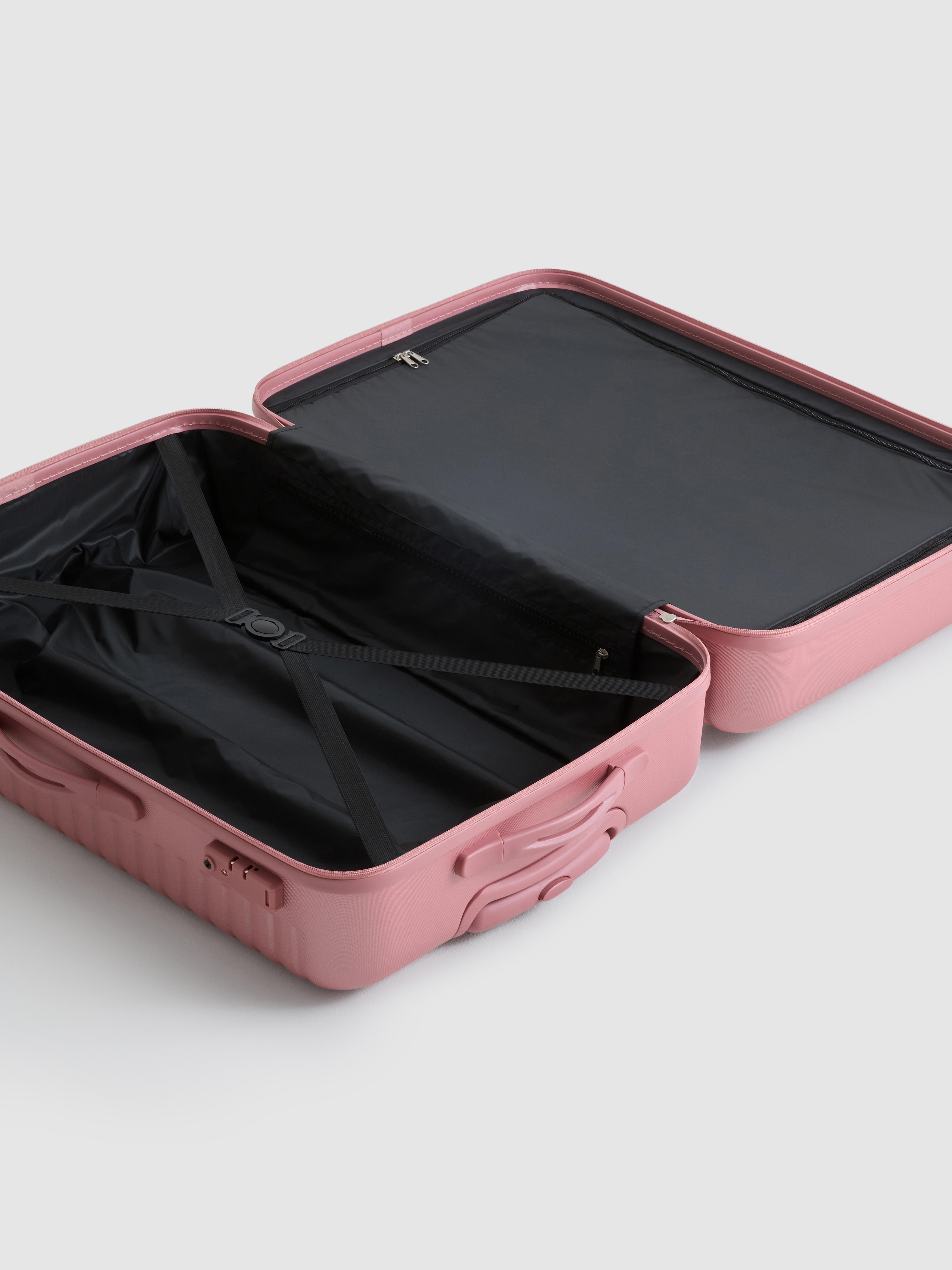 Light Pink Ribbed Four-Wheel Hard Shell Suitcase | Primark