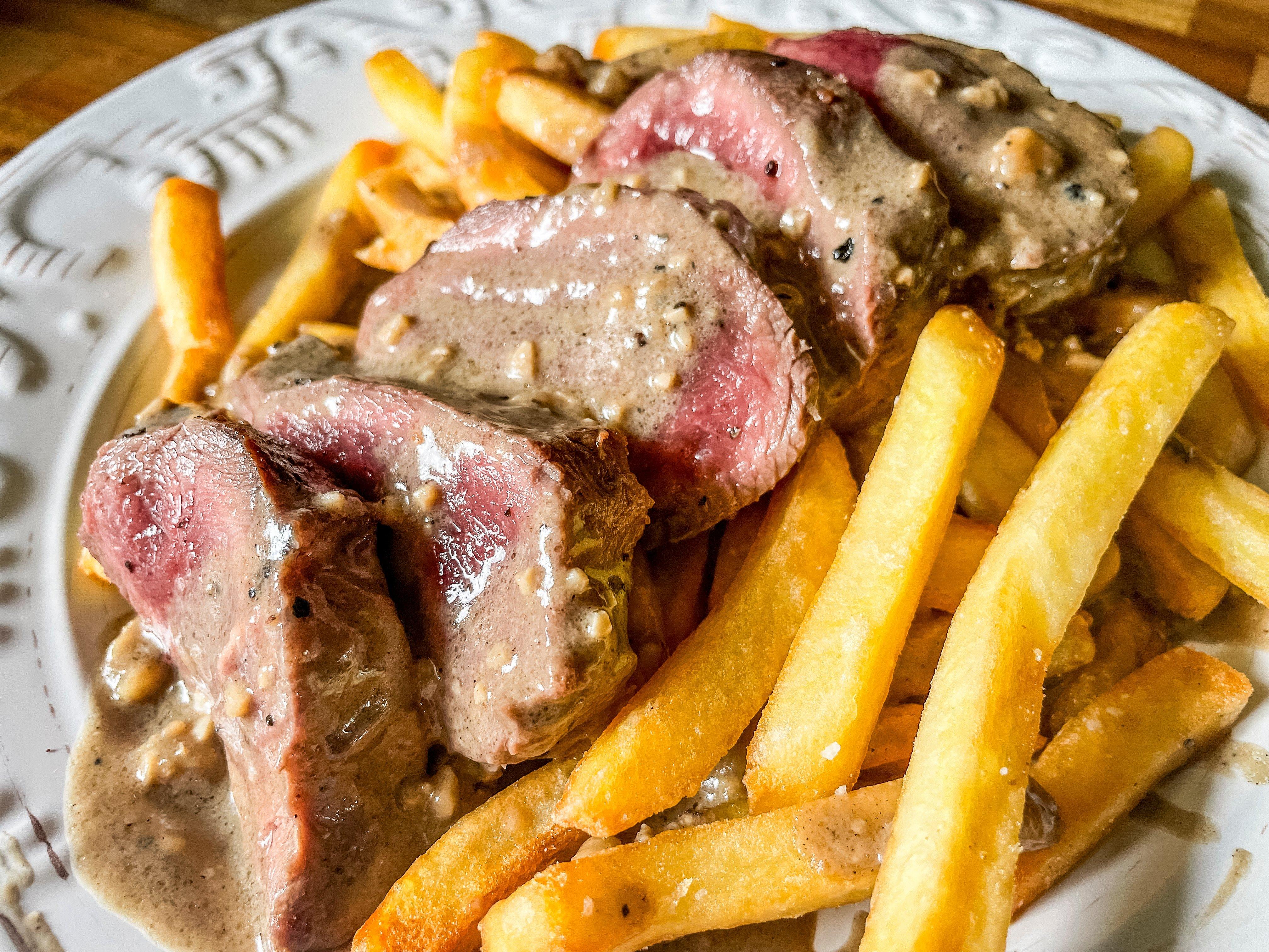 Backstrap Steak Frites with Creamy Peppercorn Bourbon Sauce - Realtree Camo