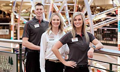 employees standing in front of the ferris wheel